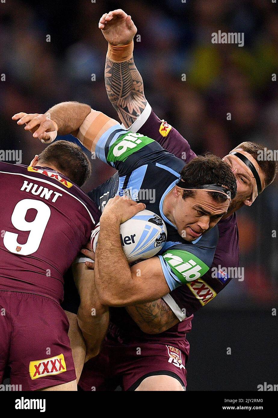 Dale Finucane of the Blues is tackled by Felise Kaufusi, Ben Hunt and ...