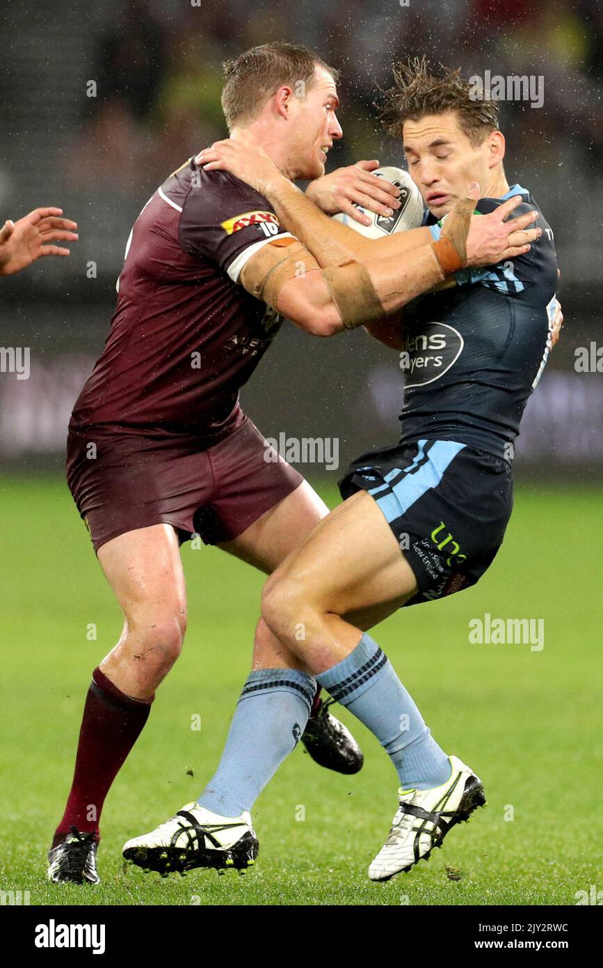 Tim Glasby of the Maroons tackles Cameron Murray of the Blues during ...