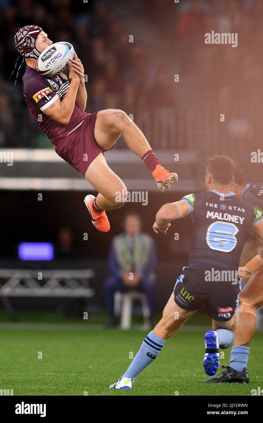 Kalyn Ponga of the Maroons contests for the ball with James Maloney of ...