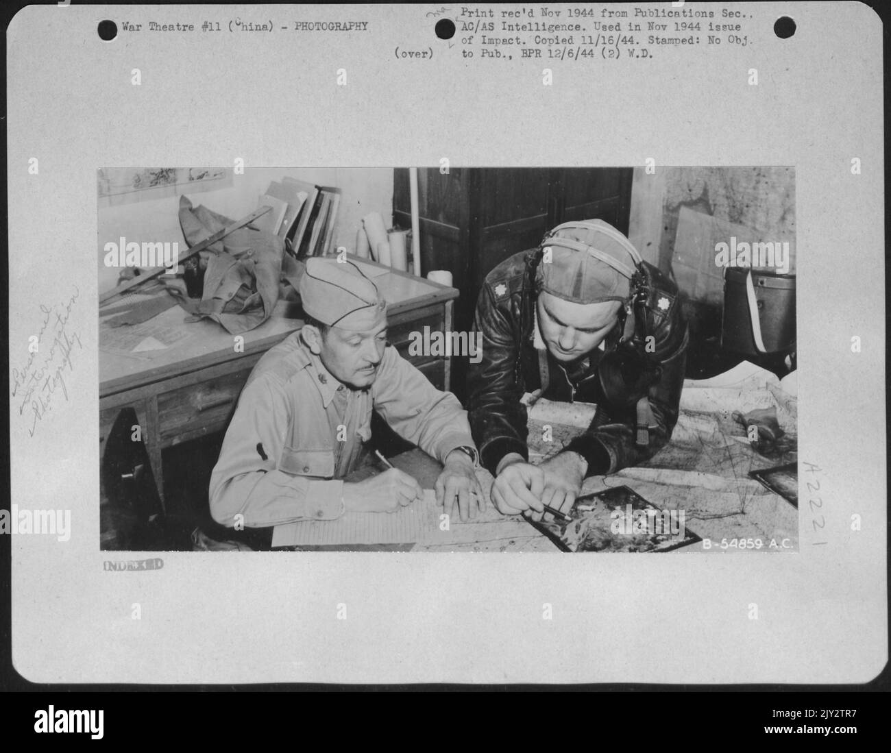 China-The squadron S-2, Major William Nicholls, interrogates Lt. Col ...