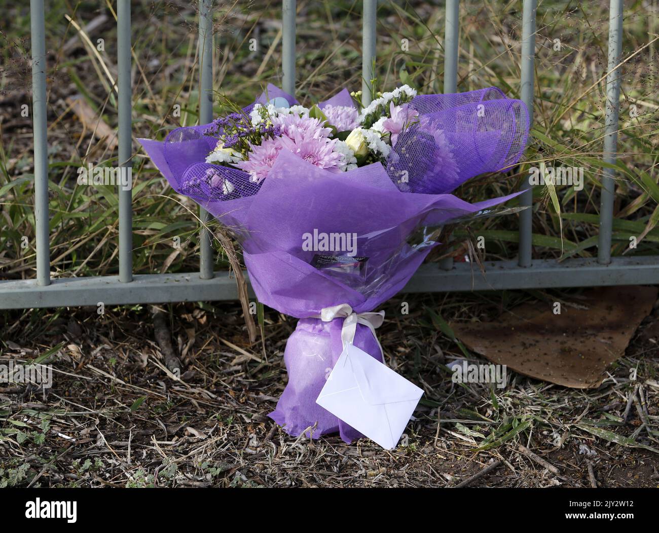 Flowers placed at the site of a fatal house fire in Singleton, NSW ...