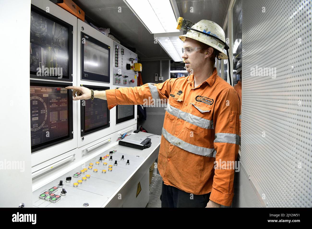 A construction worker is seen inside the equipment control room at the ...