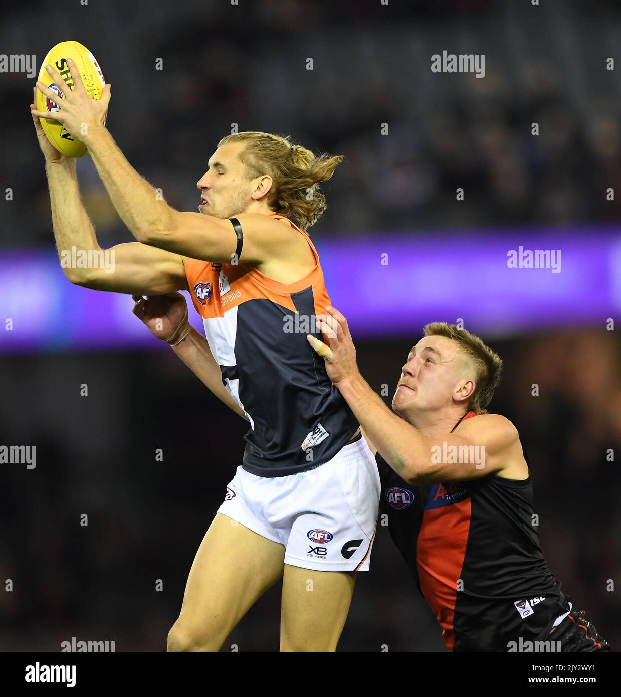 Nick Haynes of the Giants (left) and Josh Begley of the Bombers contest ...