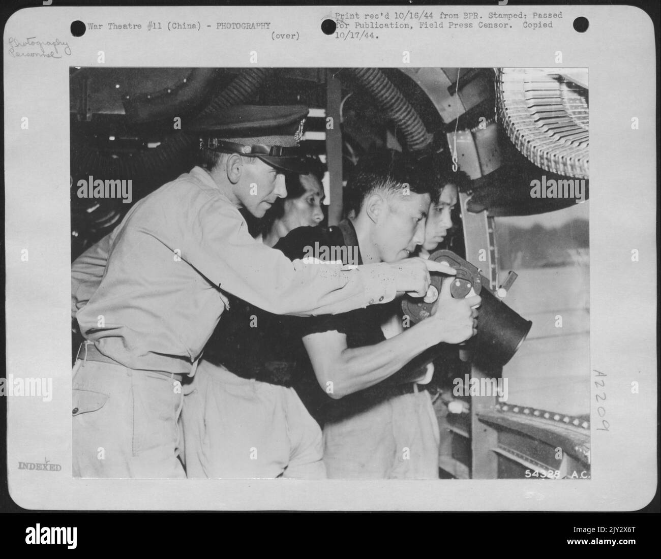 CHINA Capt. Azra Judd is Wing Photo Officer. Here he instructs Sub-Lt ...