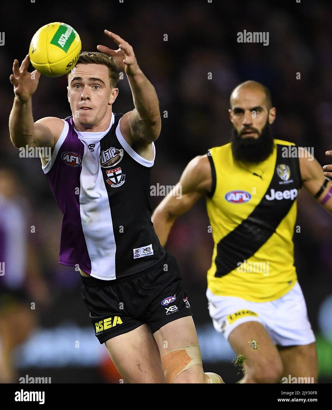 Ben Paton of the Saints (left) and Bachar Houli of the Tigers contest ...