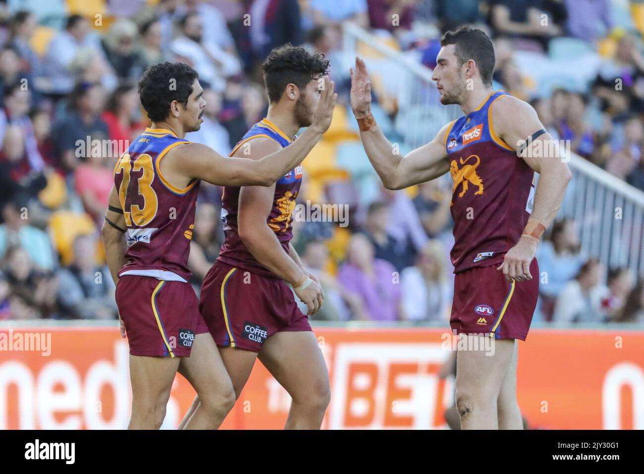 Charlie Cameron (left) of the Lions celebrates after scoring a goal ...