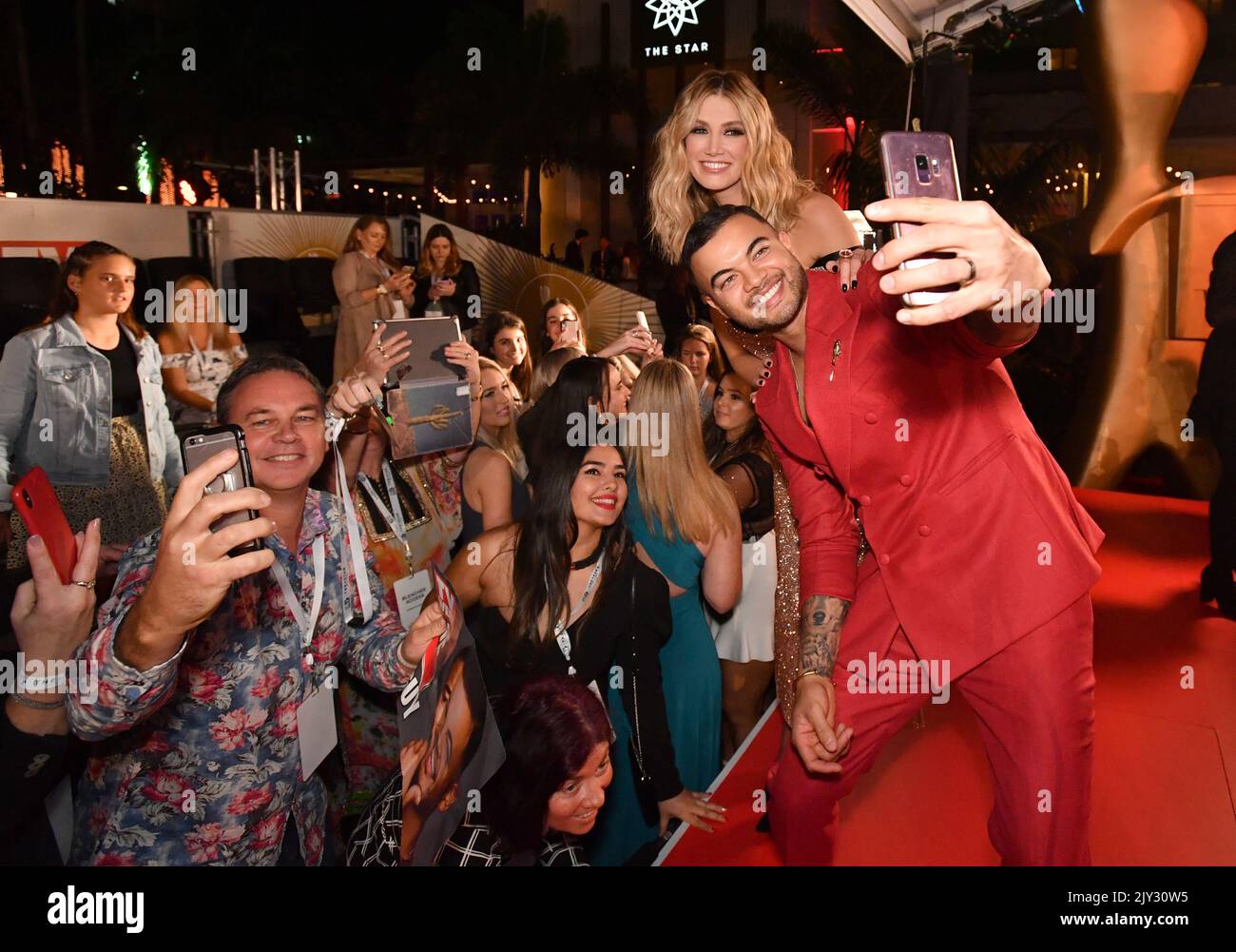 Guy Sebastian and Delta Goodrem are seen posing for selfie photographs ...