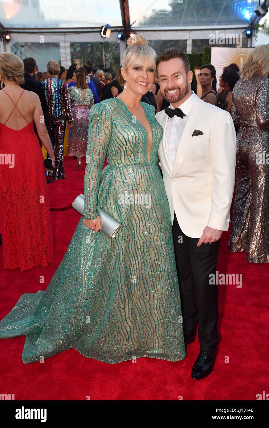 Grant Denyer (right) and his wife Cheryl (left) are seen on the red ...