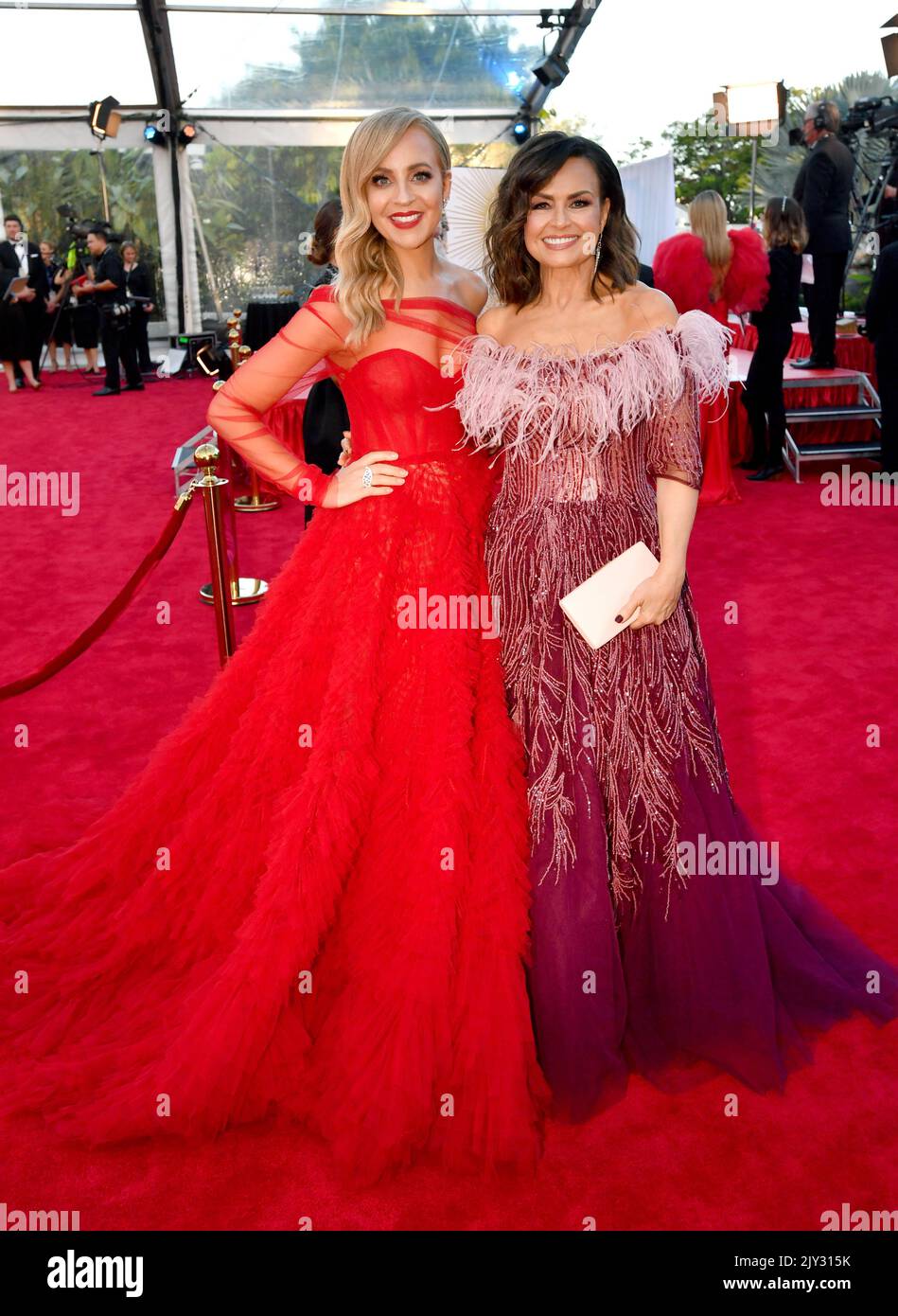 Carrie Bickmore (left) and Lisa Wilkinson (right) are seen on the red ...