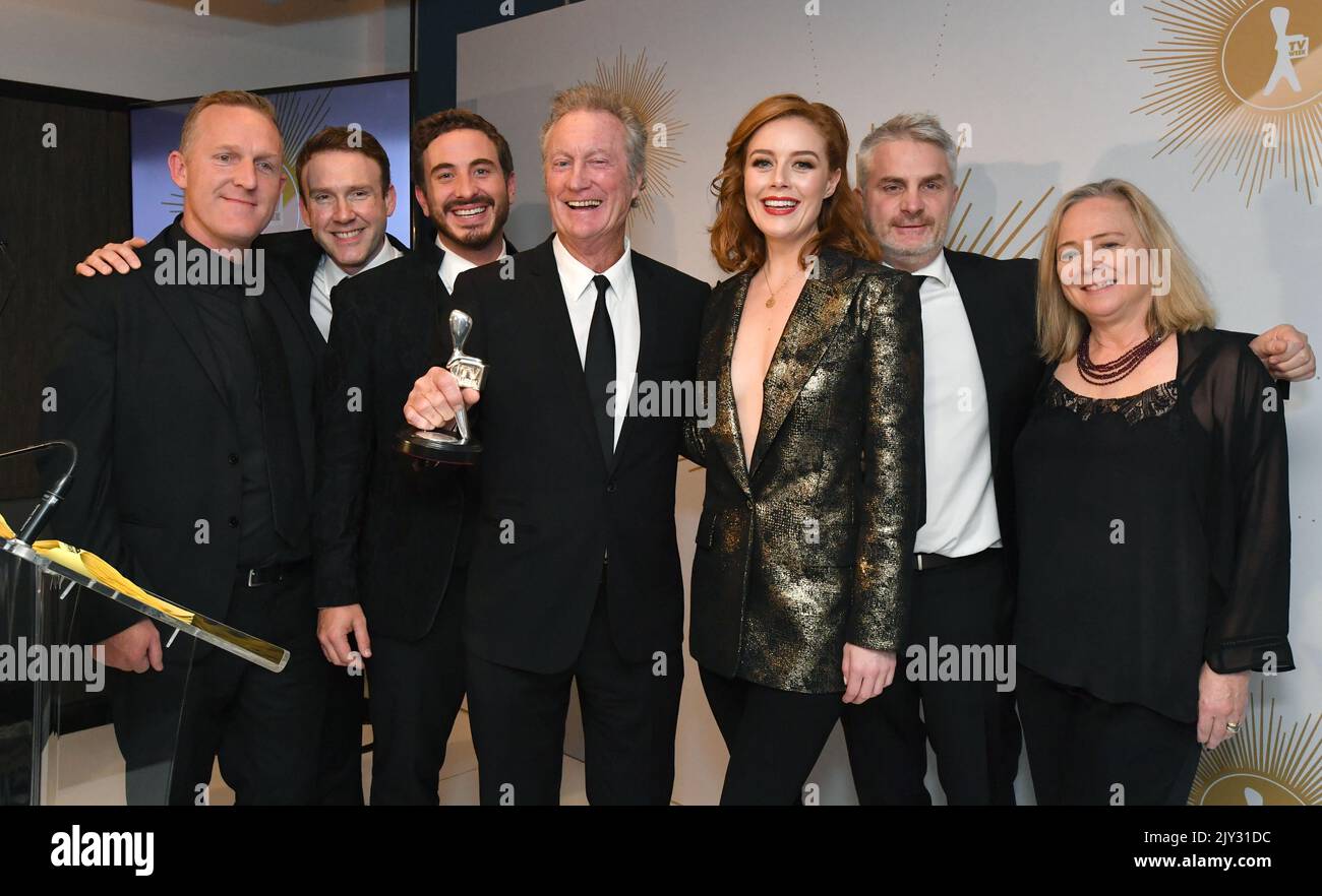 The cast of Bloom poses for a photograph with their Logie after winning ...