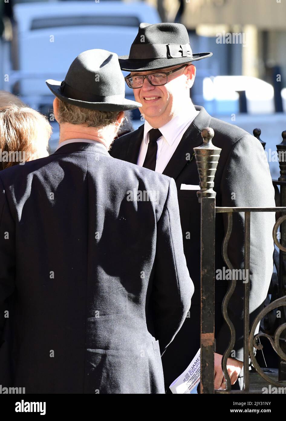 Husband Trent Goldsack (right) speaks to mourners after the Memorial ...