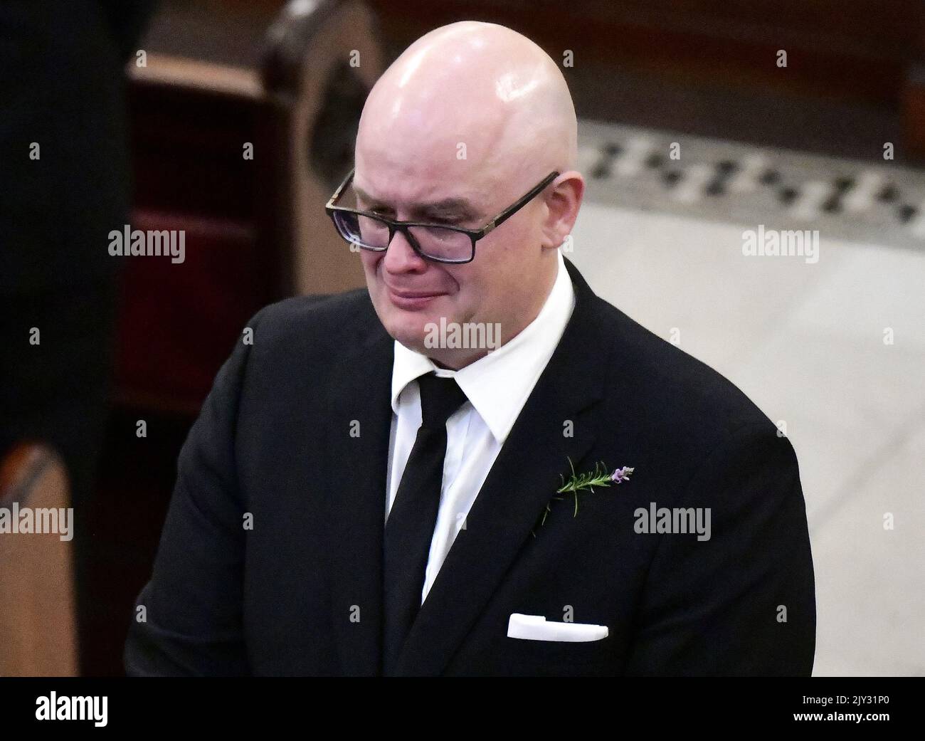 Husband Trent Goldsack (right) reacts during the Memorial Service for ...