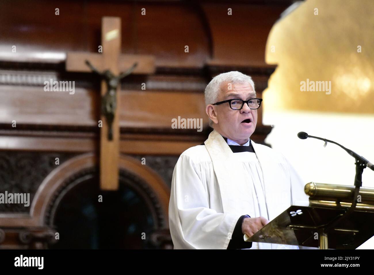 Reverend Peter Kurti speaks during the Memorial Service for parishioner ...