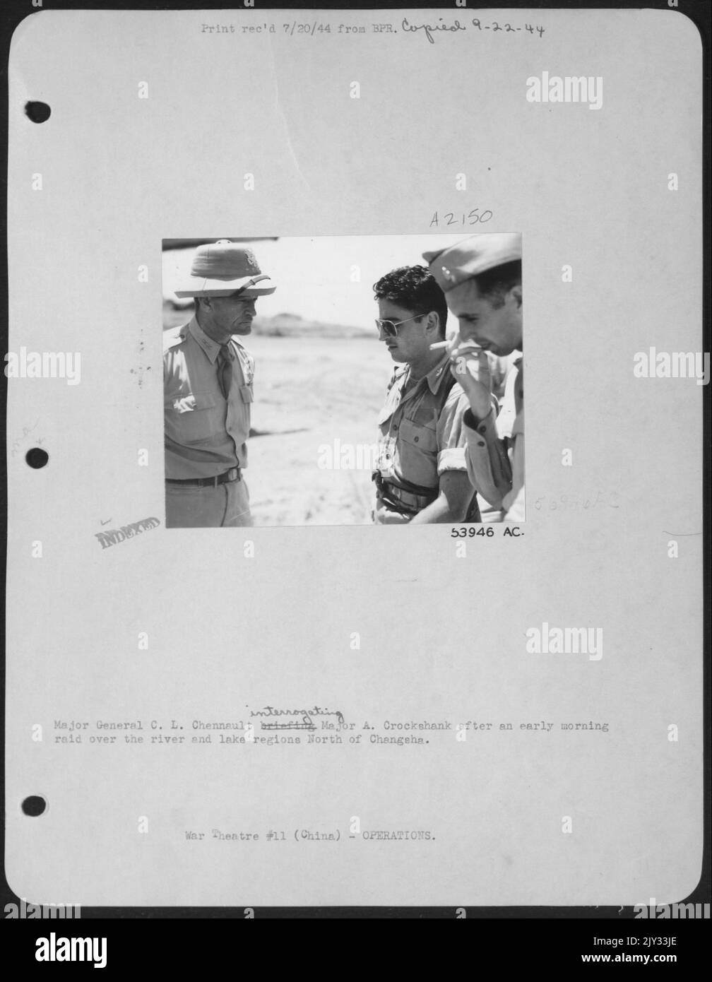 Major General C.L. Chennault interrogating Major A. Crockshank after an early morning raid over ...