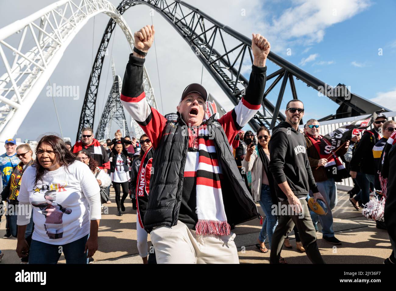 The Western Saints supporters walk across the Matagarup Bridge for the ...