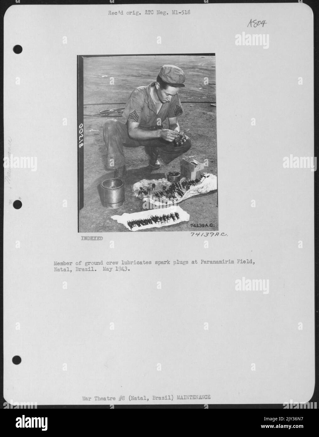 Member Of Ground Crew Lubricates Spakr Plugs At Parnamirim Field, Natal ...