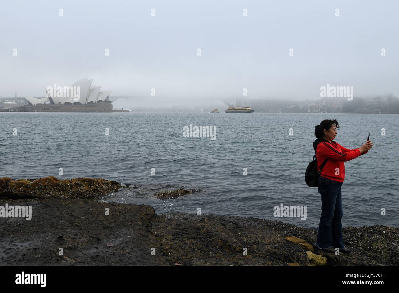 The Sydney Opera House seen during heavy morning fog in Sydney, Sunday ...