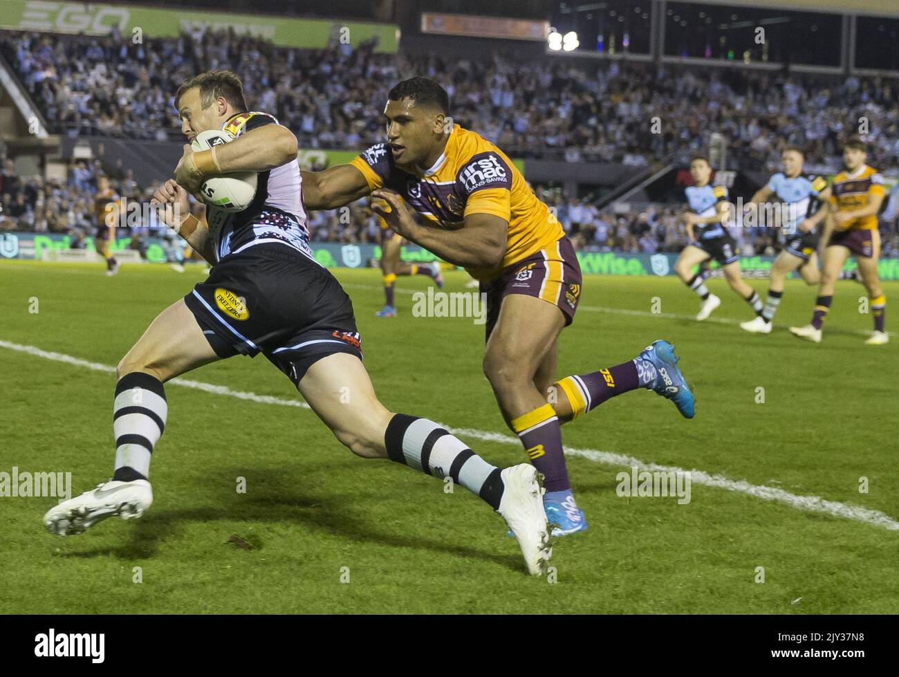 Josh Morris of the Sharks scores during the Round 16 NRL match between ...