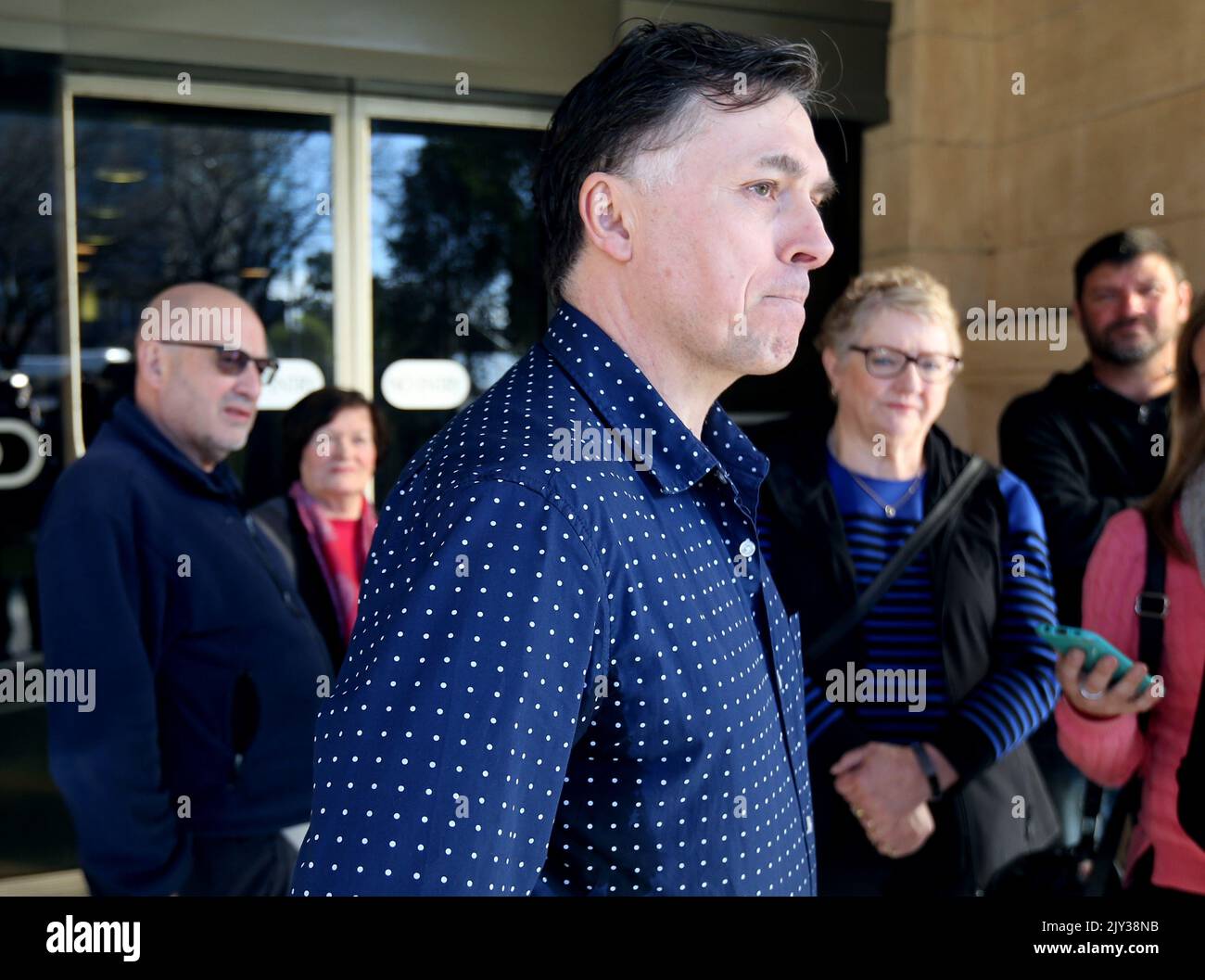 Victim Paul Bayly speaks to the media outside the District Court in ...