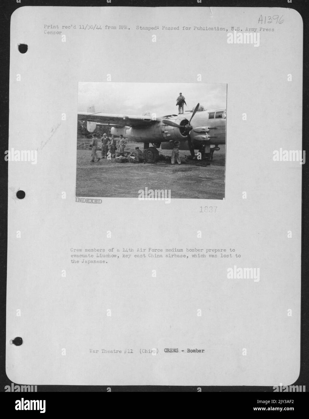 Crew Members Of A 14Th Air Force Medium Bomber Prepare To Evacuate ...