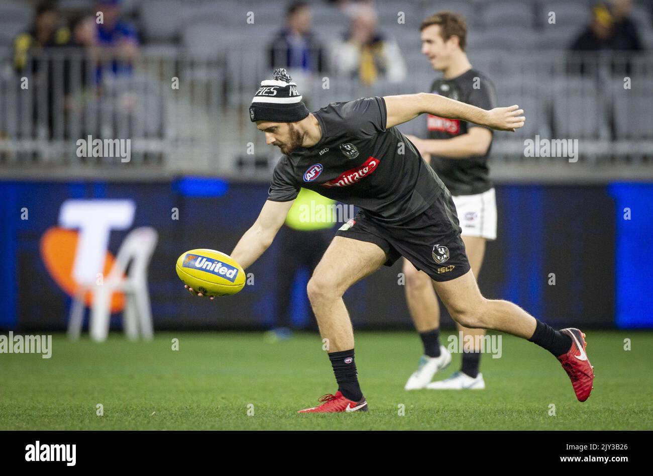 Tom Phillips of Collingwood warms up before the Round 17 AFL match ...