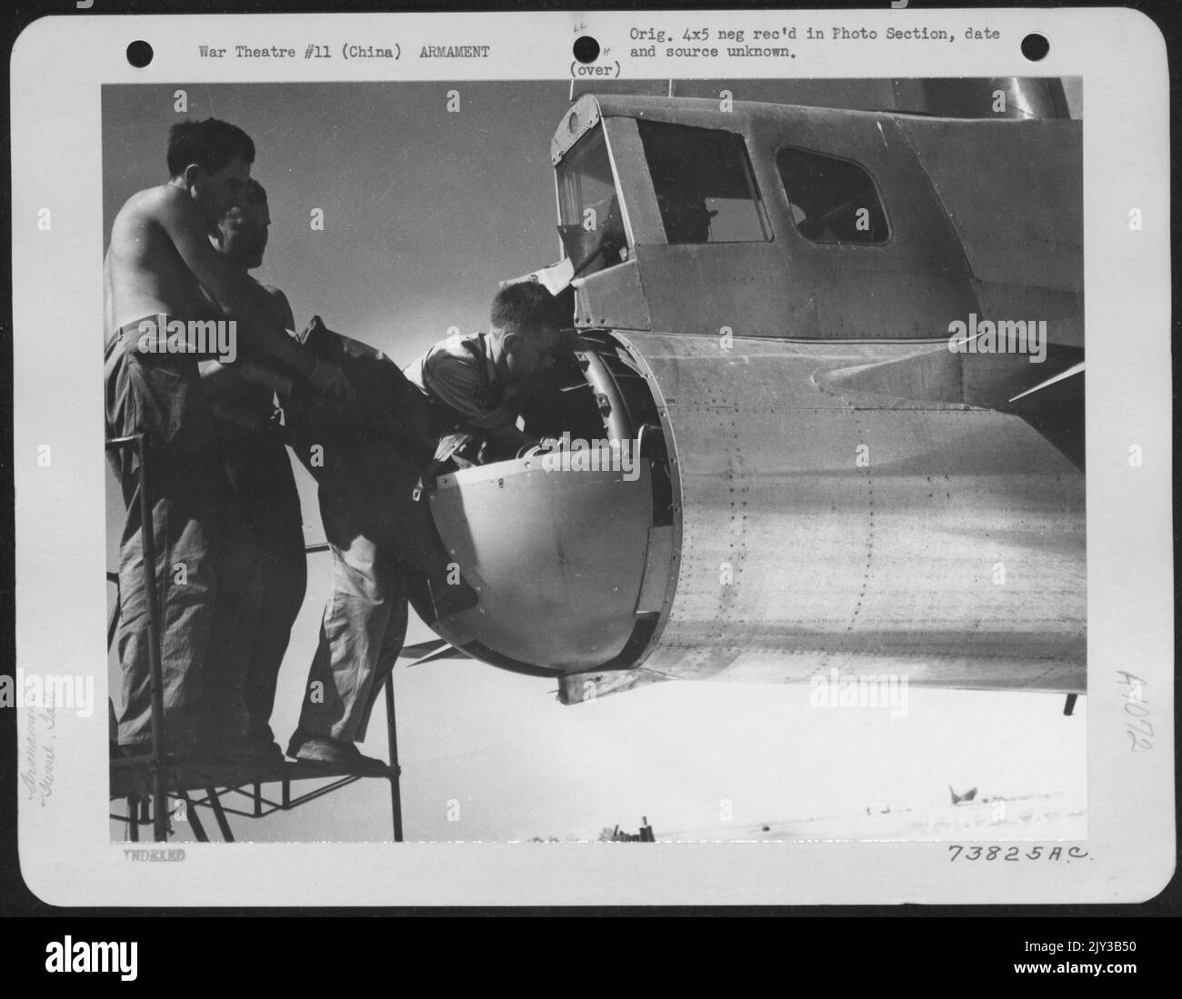 Armorers Install A Gun In The Tail Component Of A Boeing B-29 ...