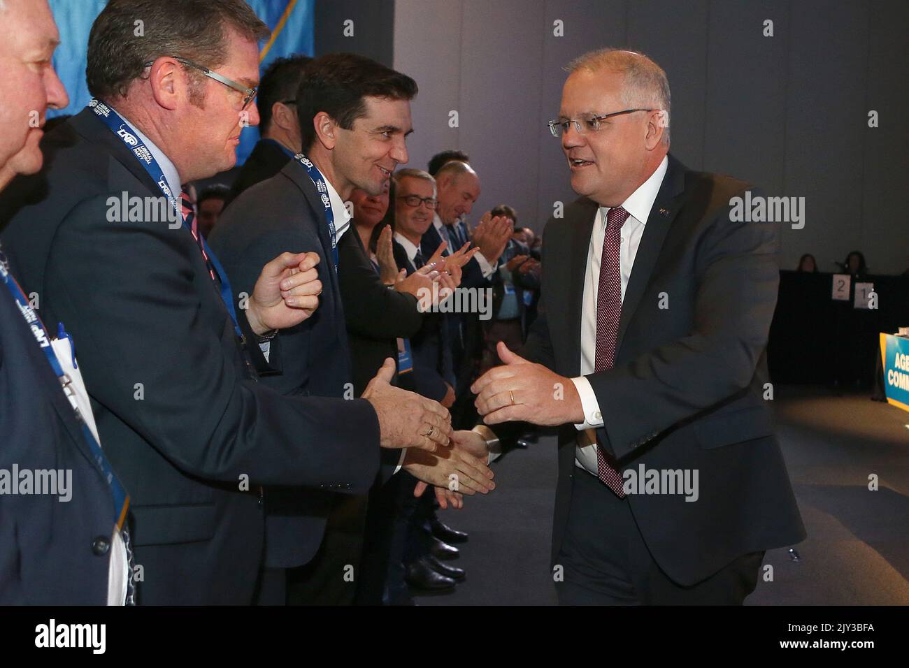 Prime Minister Scott Morrison (right) arrives to speak at the LNP ...