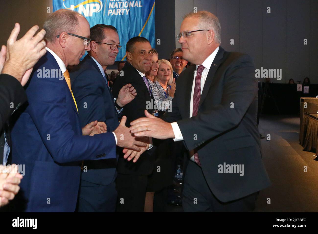 Prime Minister Scott Morrison (right) arrives to speak at the LNP ...