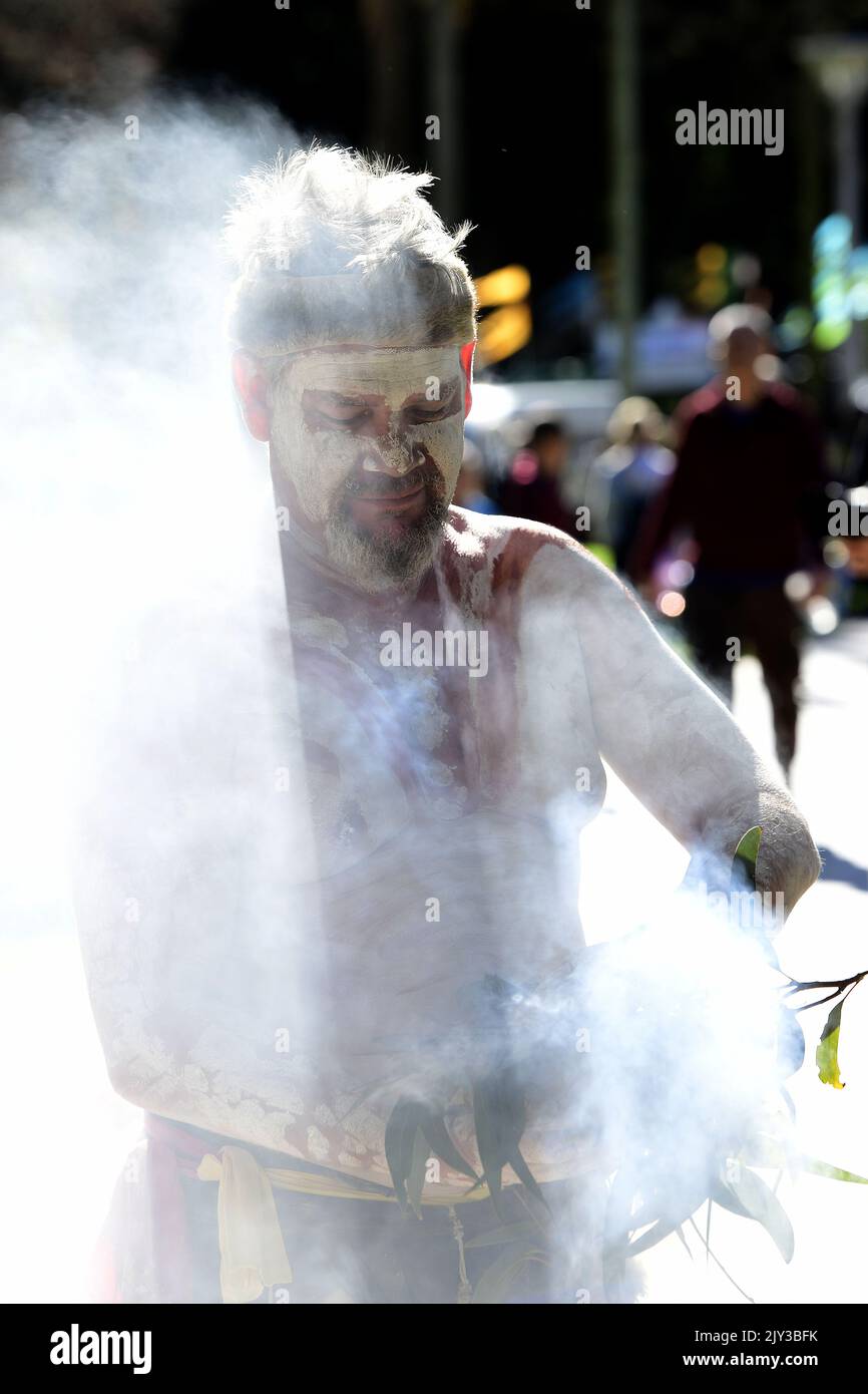 Matthew Doyle carries out a roaming smoking ceremony during The City of ...