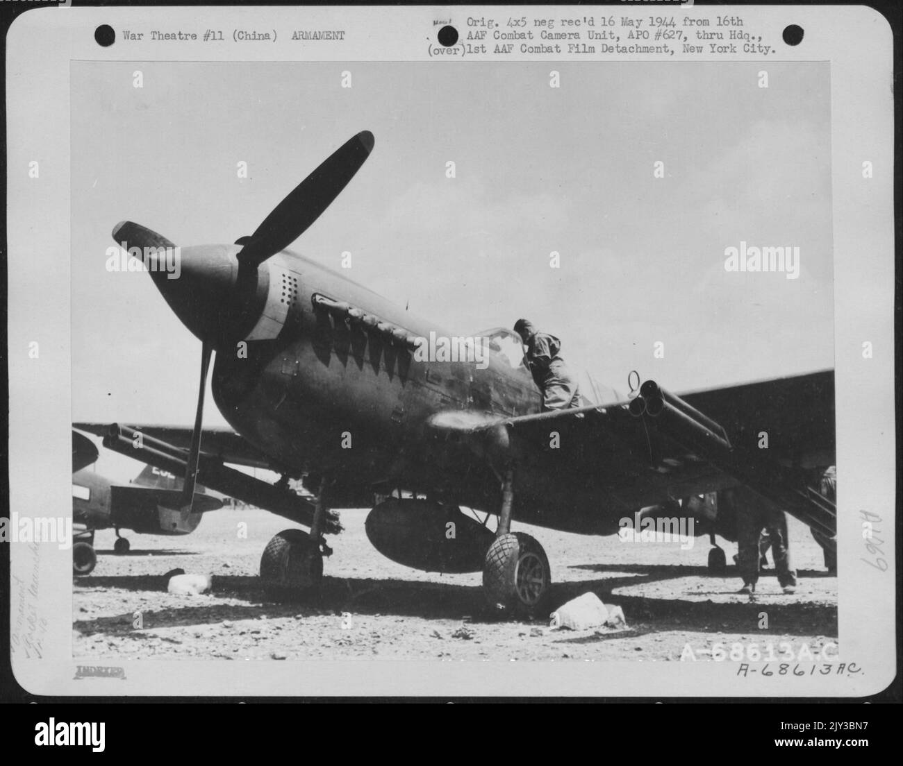 Rocket Launchers Are Installed On Both Wings Of A Curtiss P-40 At An ...