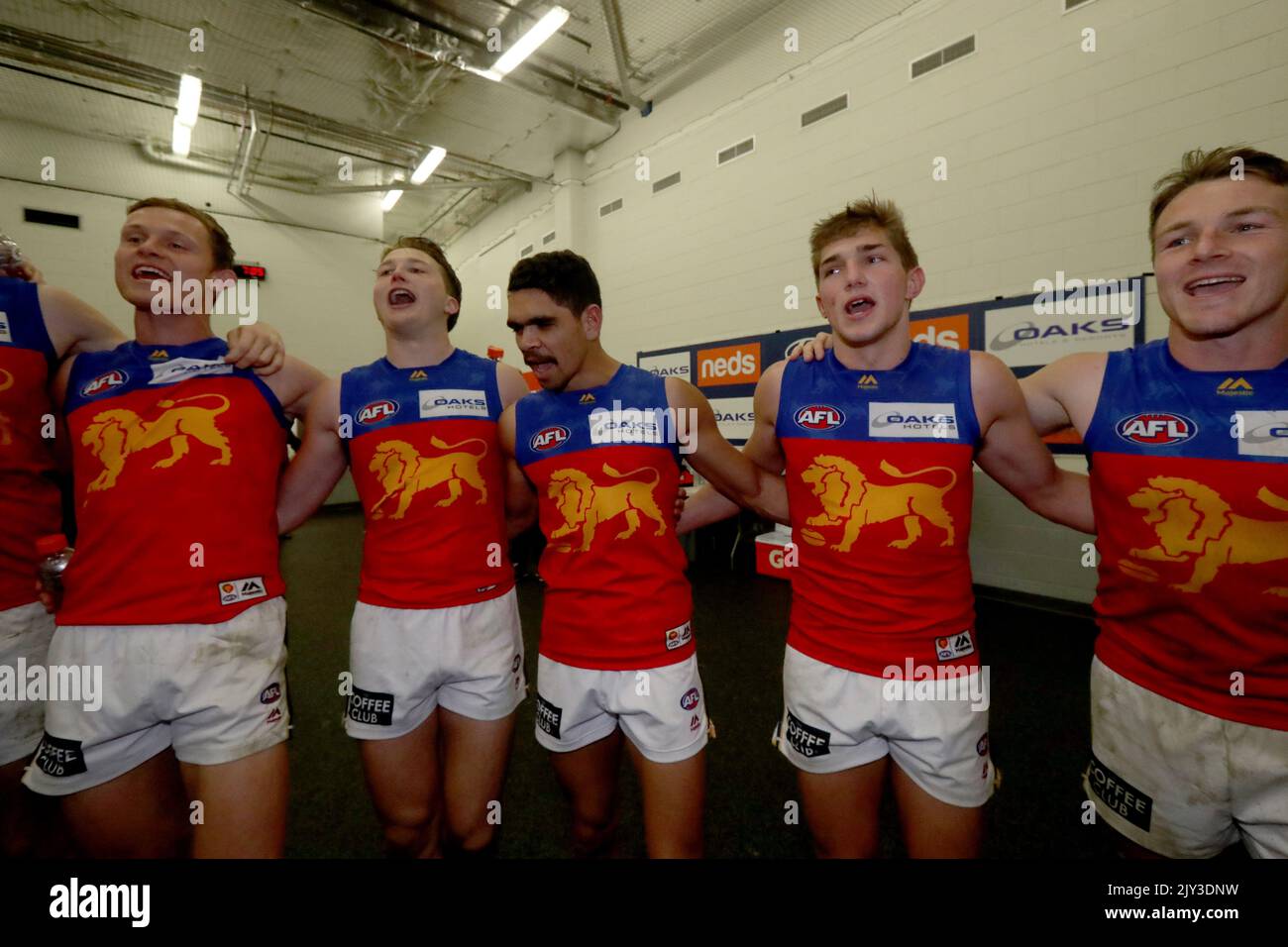 Lions players celebrate the win by singing the club song during the ...