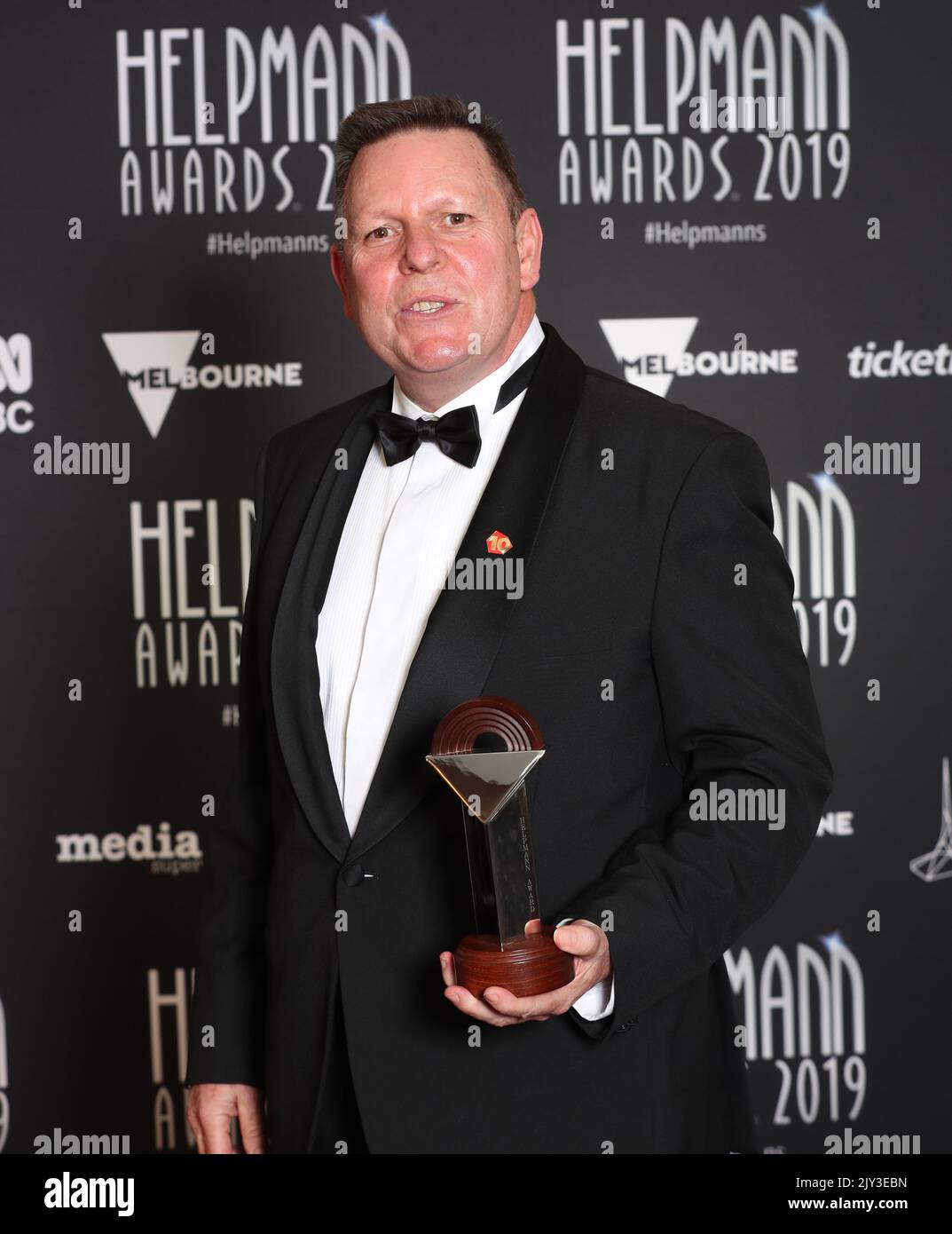 Euan Murdoch poses for a photograph with his award for Best Chamber and ...
