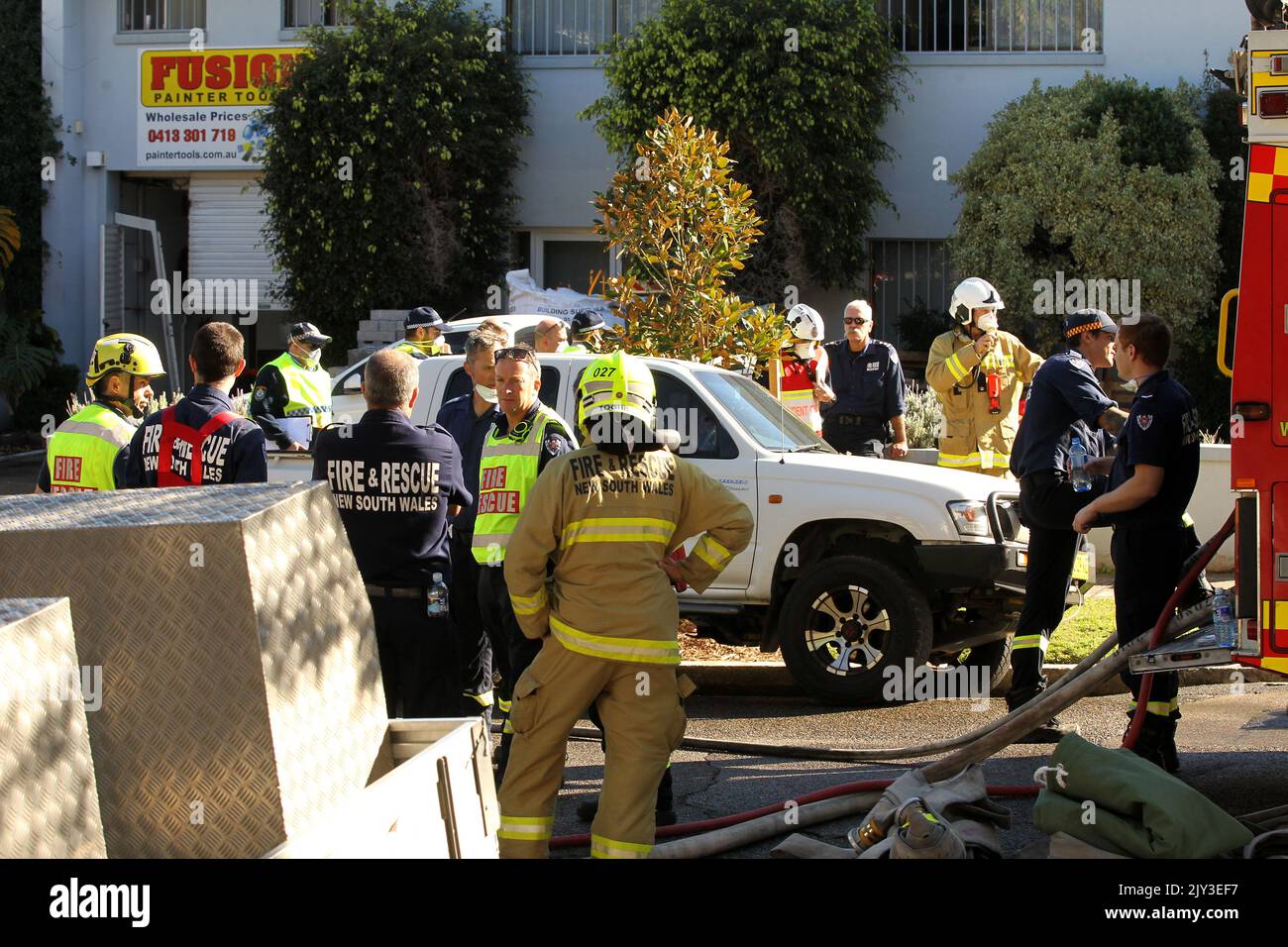 Emergency services are seen at the scene of a factory fire in ...