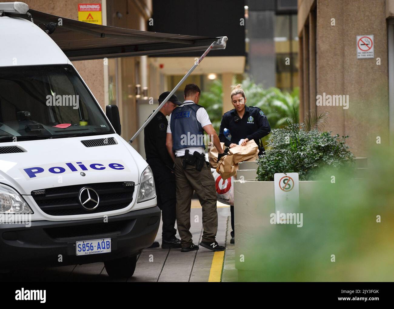 South Australian police officers are seen at a residential complex in ...