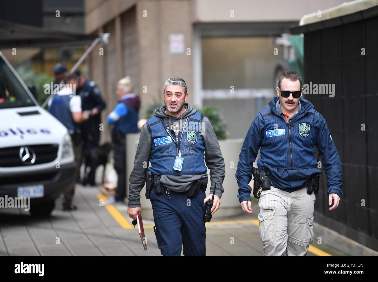 South Australian police officers are seen at a residential complex in ...