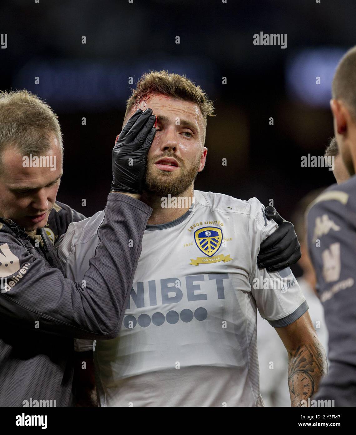 Stuart Dallas of Leeds is injured during the Manchester United and ...