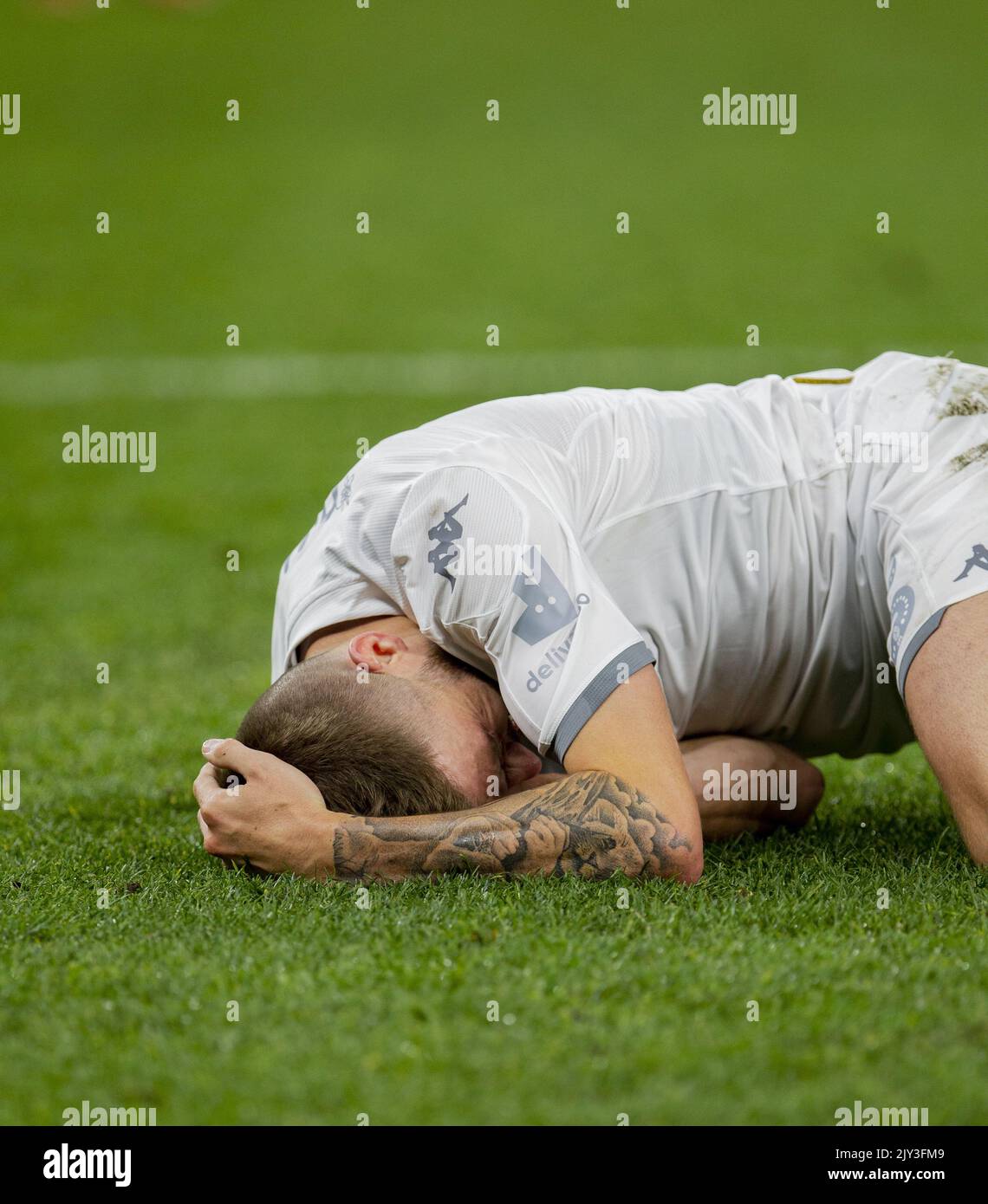 Stuart Dallas of Leeds is injured during the Manchester United and ...