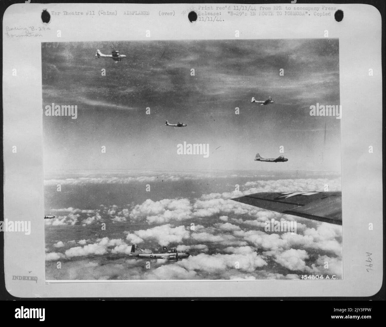 Seven B-29s of the U.S. Army 20th Air force are seen here in formation ...