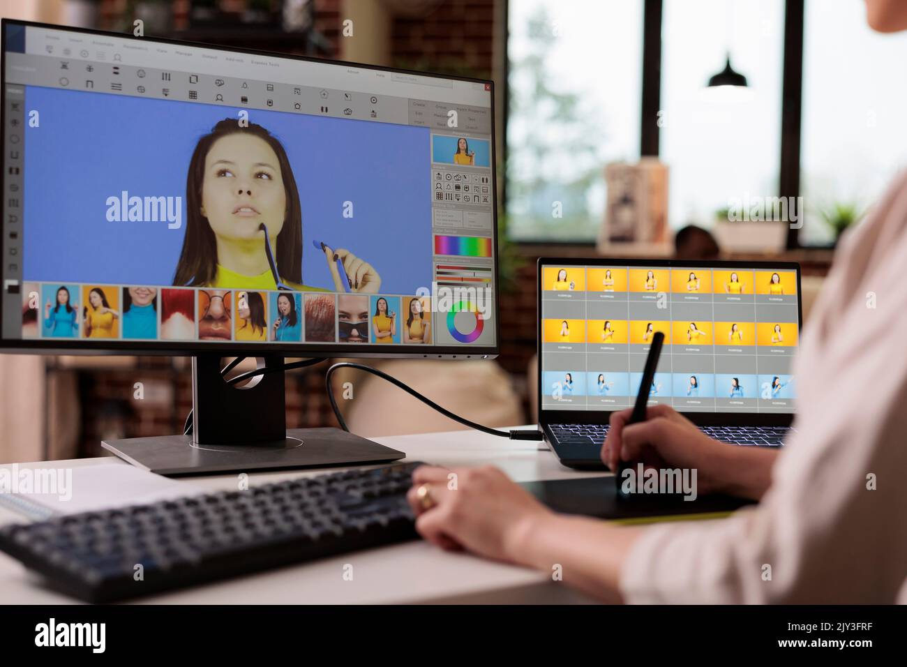 Creative freelancer editing picture with retouching software, using ...
