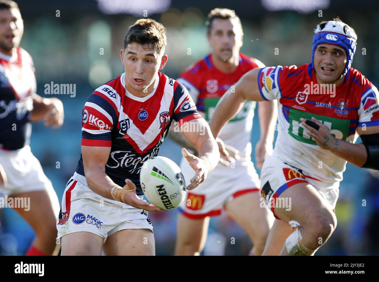 Victor Radley of the Roosters passes the ball during the Round 18 NRL ...