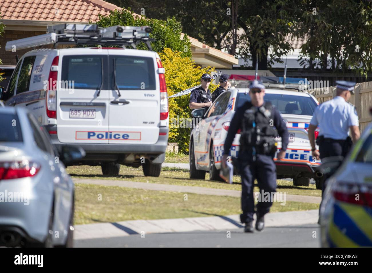 Police and forensic police are seen at a crime scene in Cassowary St ...
