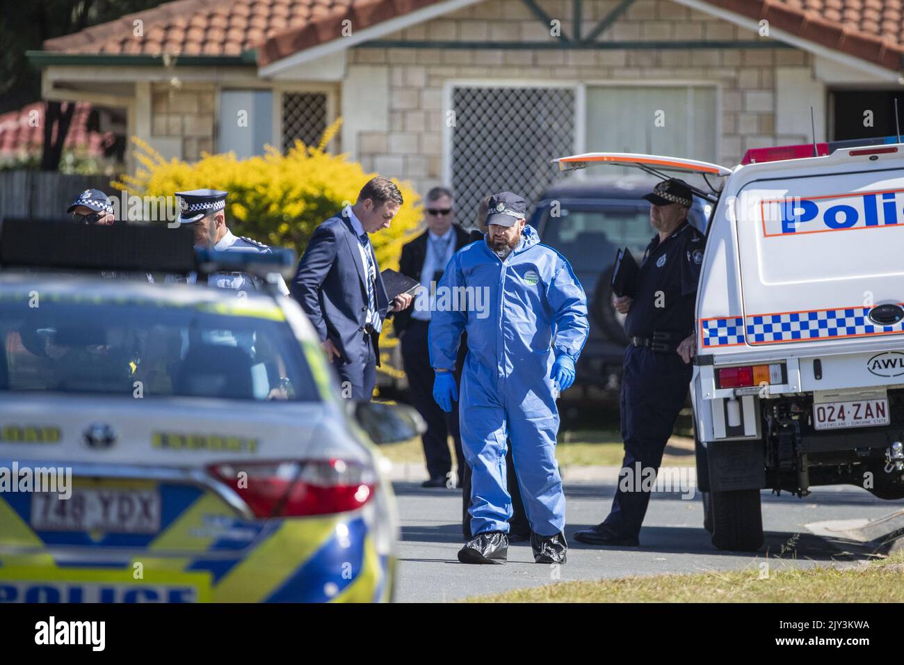 Police and forensic police are seen at a crime scene in Cassowary St ...