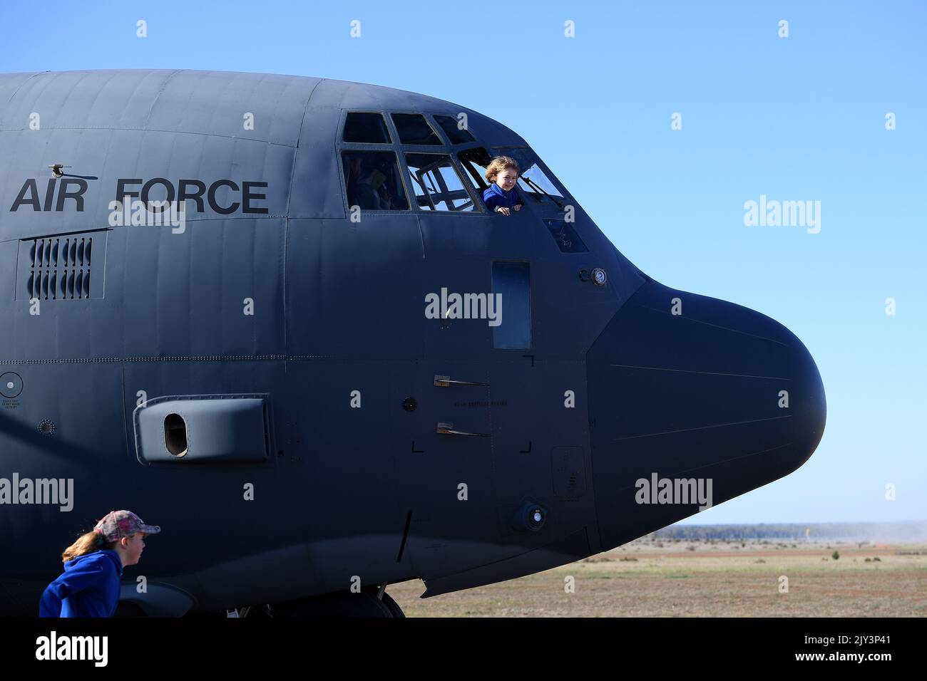 A child looks out the window of a Royal Australian Air Force C-130J ...