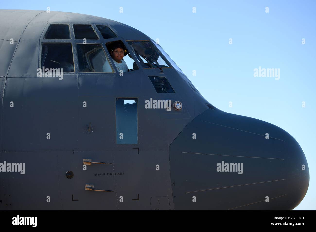 A child looks out the window of a Royal Australian Air Force C-130J ...