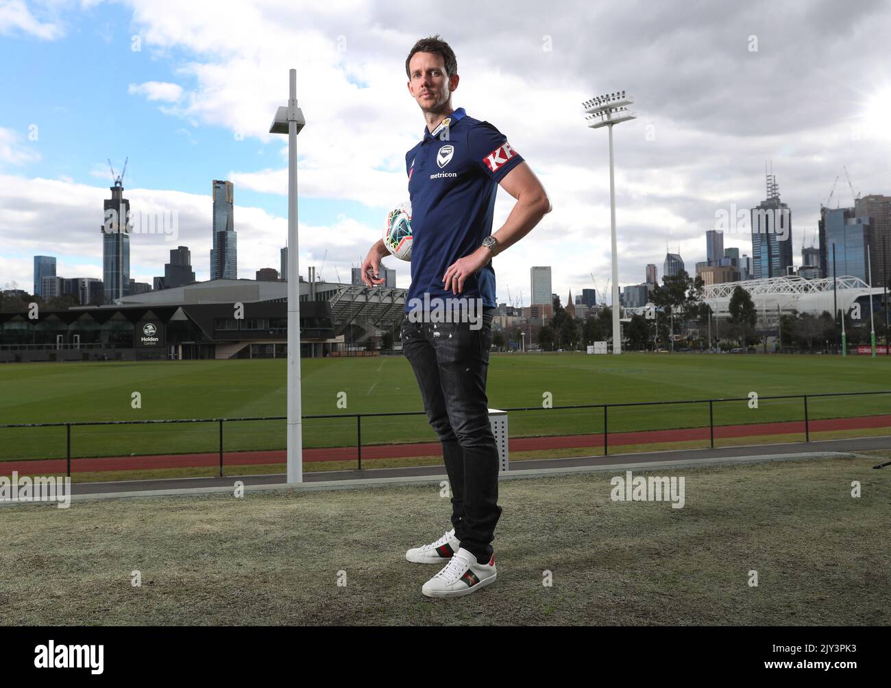 Melbourne Victory sign up Robbie Kruse poses for a photo after a press ...