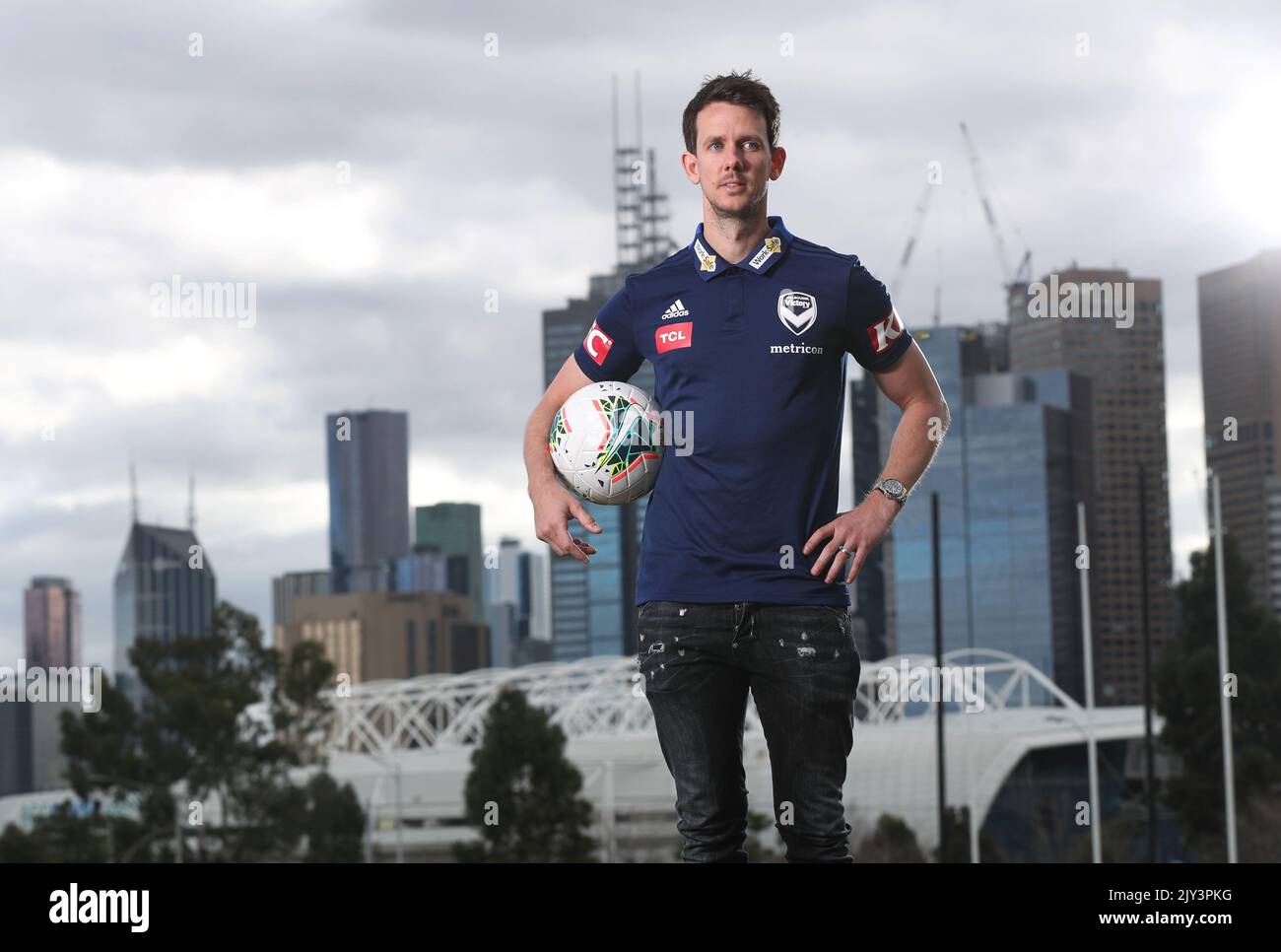 Melbourne Victory sign up Robbie Kruse poses for a photo after a press ...