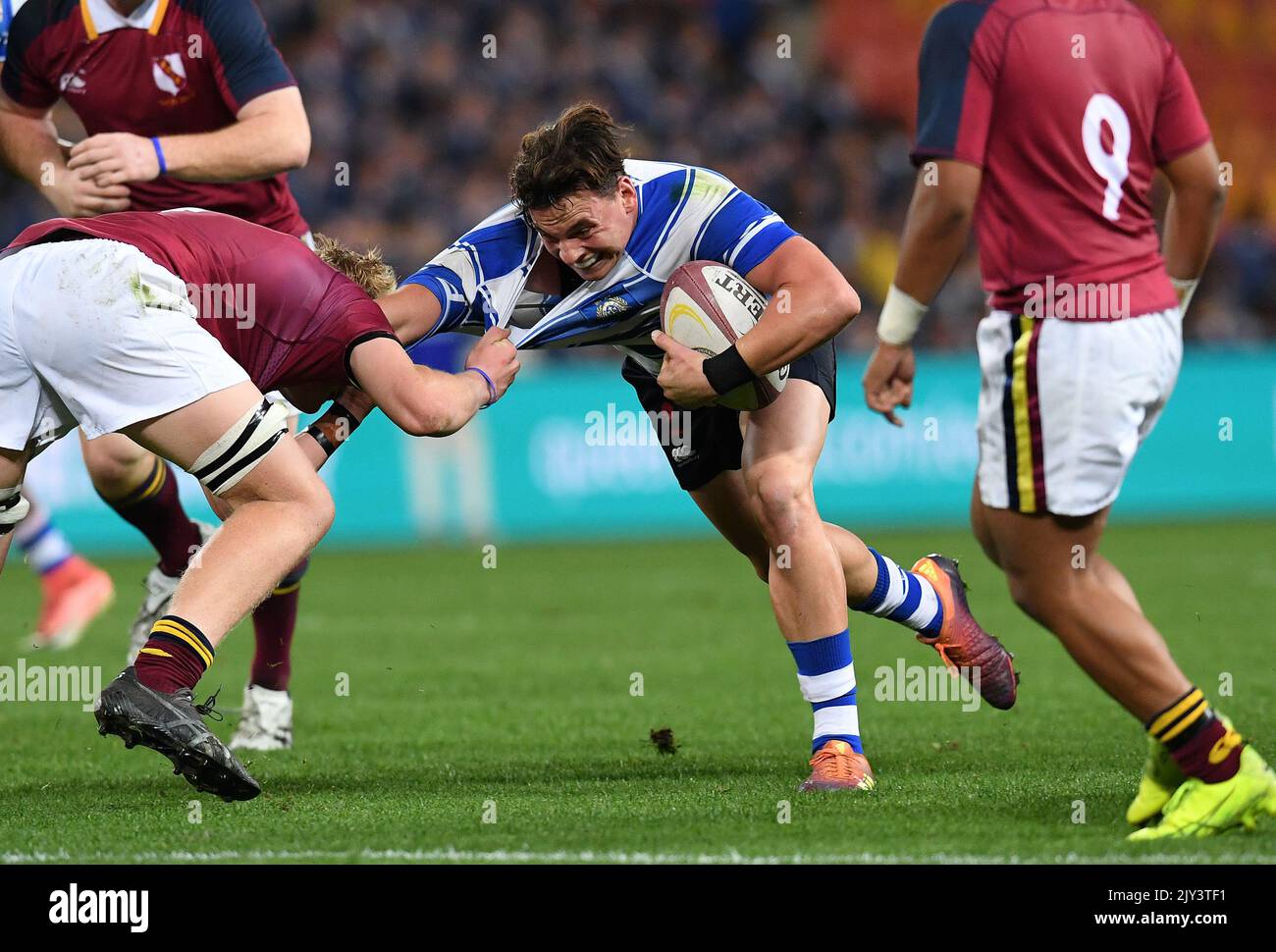 Ronin Nutley of Nudgee College (centre) in action during the St Joseph ...