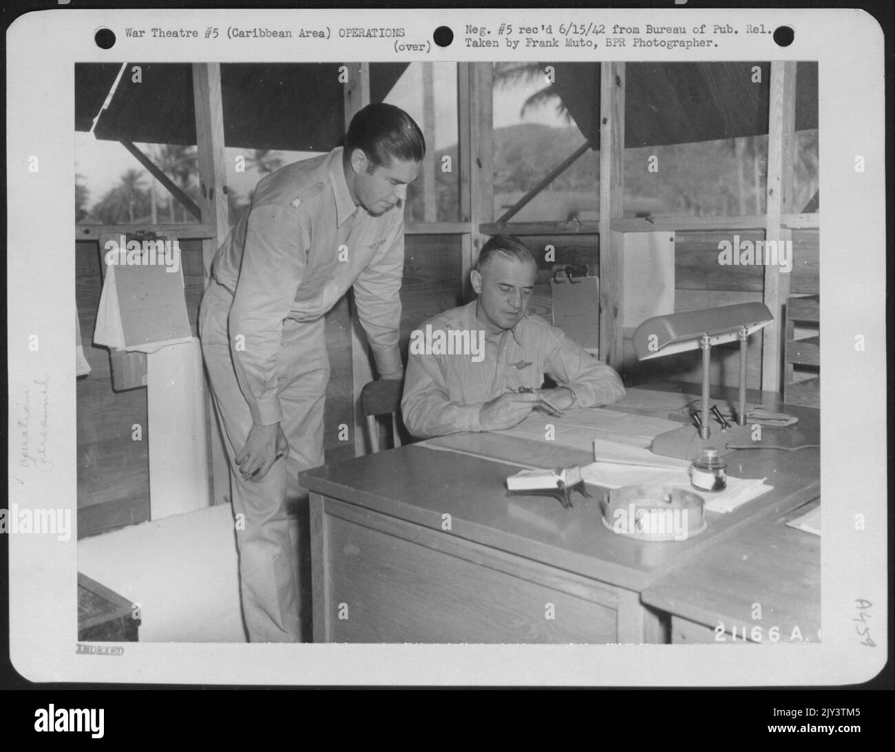 Lt. Col. Gerald E. Williams, Group Commander, conferring with Brig. Gen ...