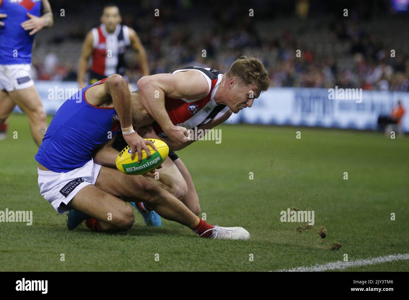 Christian Salem of the Demons slips a Jack Lonie of the Saints tackle ...