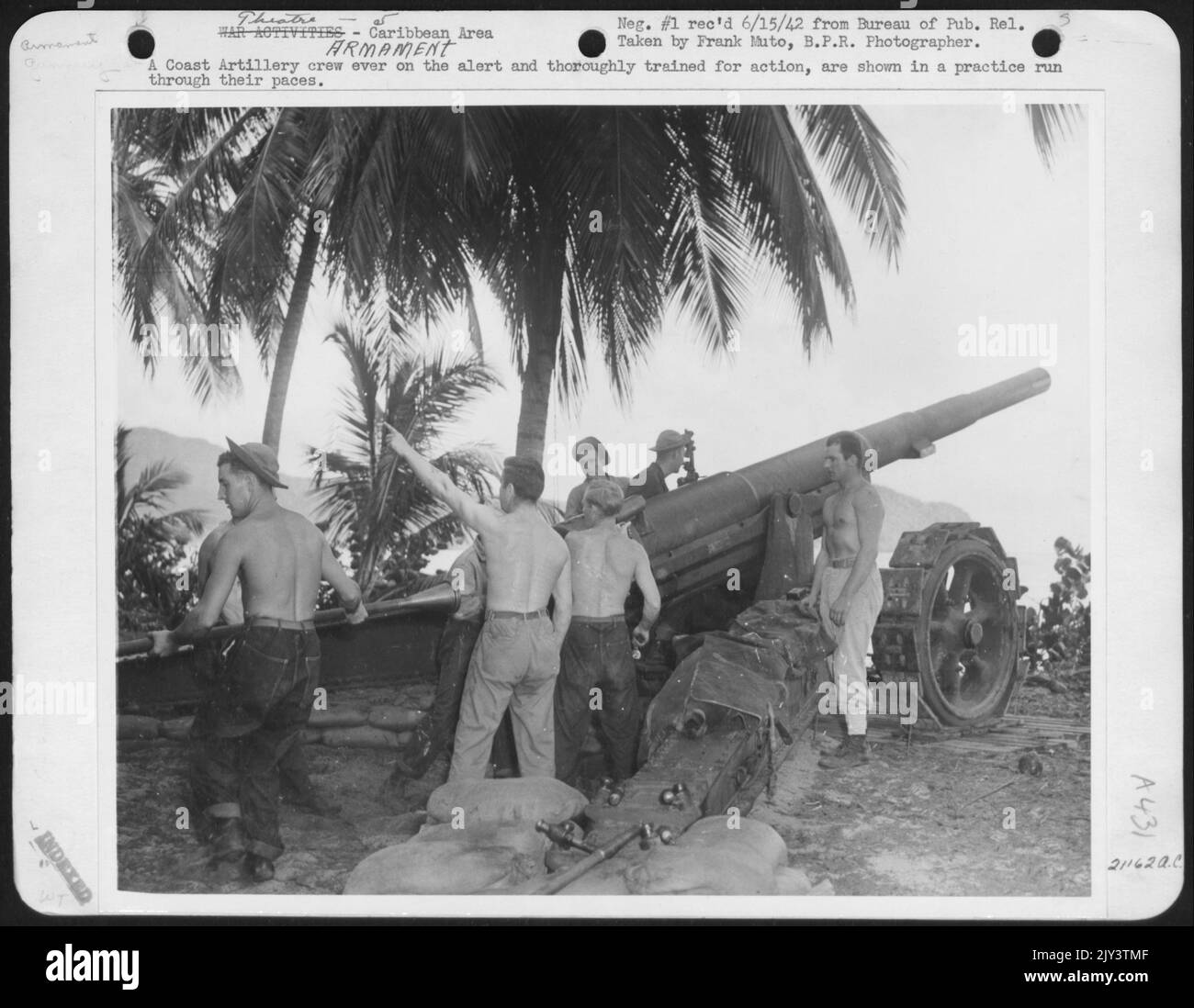 A Coast Artillery crew ever on the alert and thoroughly trained for ...